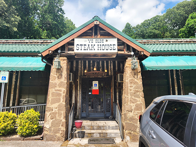The rustic log cabin exterior with its signature green awning promises what every carnivore dreams of&mdash;a no-nonsense temple to perfectly cooked beef.
