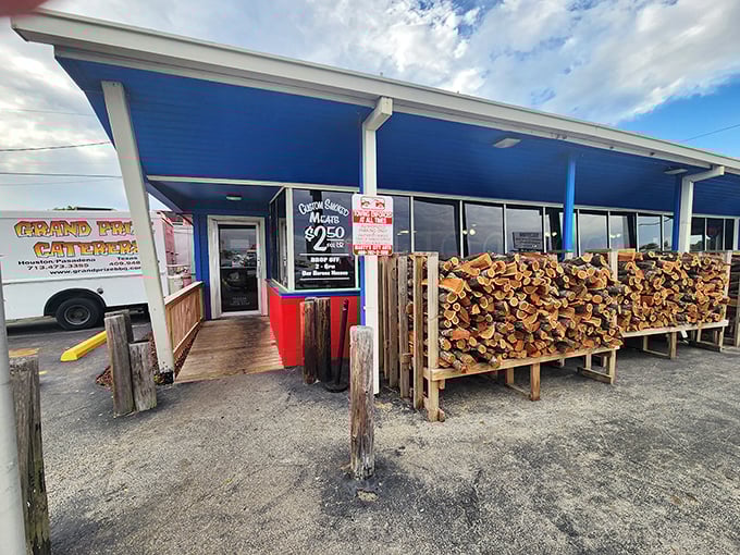 The entrance tells the whole story: serious wood for serious smoke. That stack isn't for show&mdash;it's tomorrow's flavor in waiting.