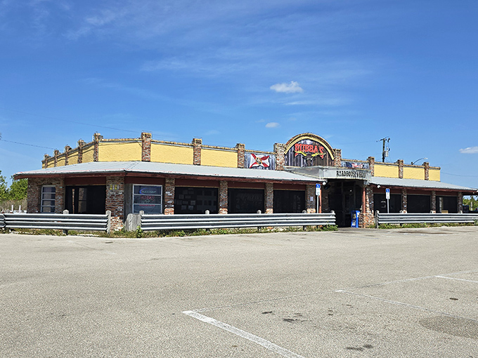 The unassuming yellow exterior of Bubba's Roadhouse & Saloon stands like a beacon of hope for hungry travelers. No fancy frills, just the promise of honest-to-goodness good food inside.