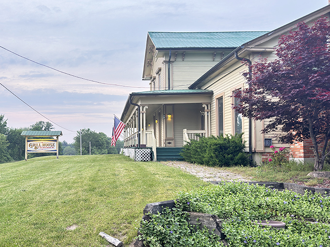The white clapboard exterior with its distinctive turquoise roof feels like stepping into a Norman Rockwell painting where prime rib dreams come true.