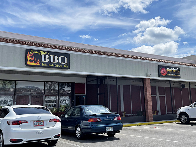 The unassuming strip mall exterior hides BBQ greatness, complete with a vintage VW bus that's seen more adventures than most of us. 