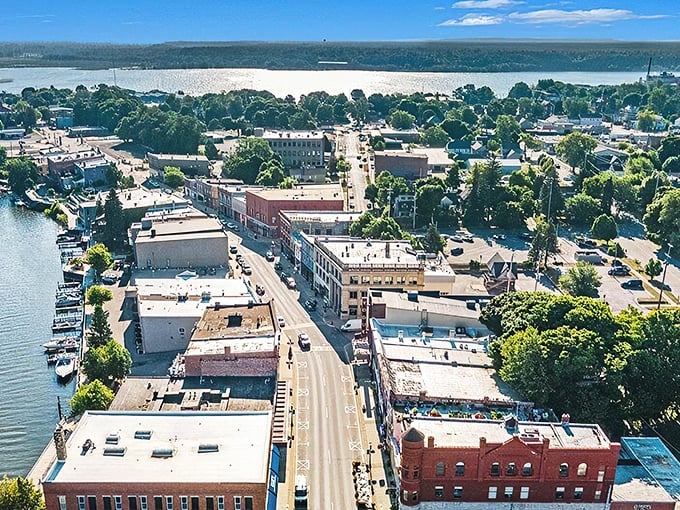An aerial view of Manistee that looks like someone took a perfect small town and placed it between two shimmering bodies of water. Pure Michigan indeed!