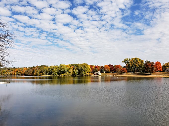 Nature's mirror game is strong here, doubling the autumn magic with perfect lake reflections.