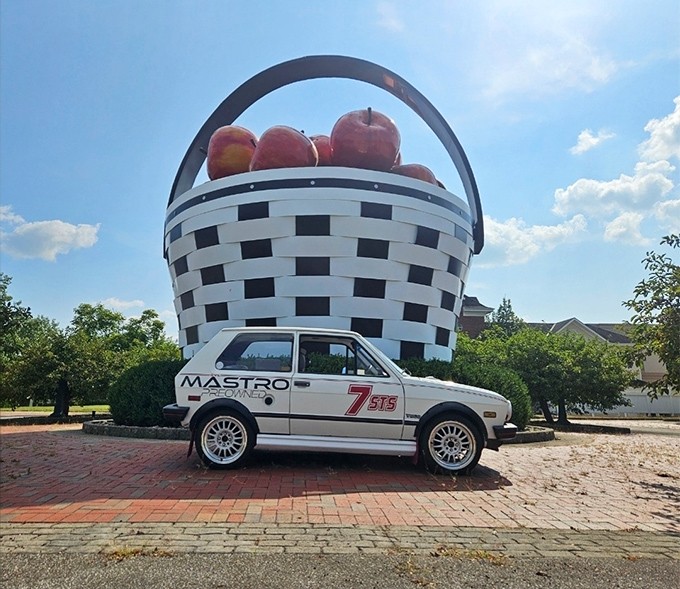 The World's Largest Apple Basket stands proudly against an overcast Ohio sky, proving that sometimes the best roadside attractions are exactly what they claim to be.