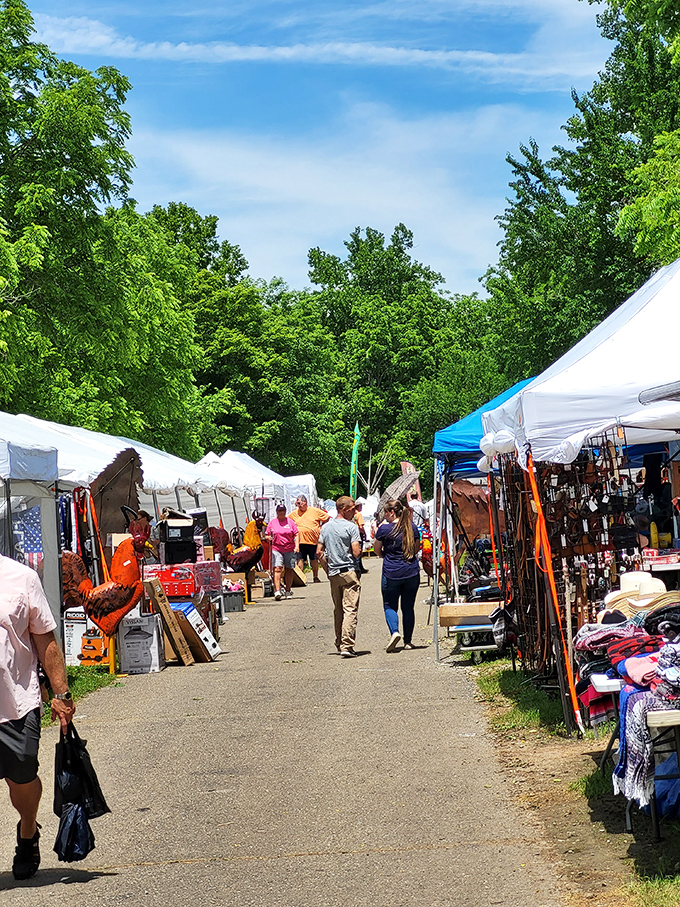 The main entrance to Friendship Flea Market stands proudly under Indiana's blue sky, with food stalls promising corn dogs and funnel cakes that'll make your diet cry uncle.
