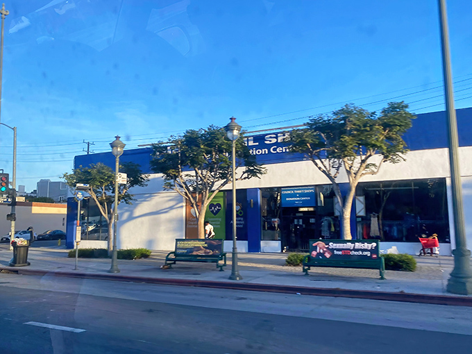 The vibrant blue and white exterior of The Council Shop stands out on Santa Monica Boulevard like a beacon for treasure hunters and bargain enthusiasts alike.