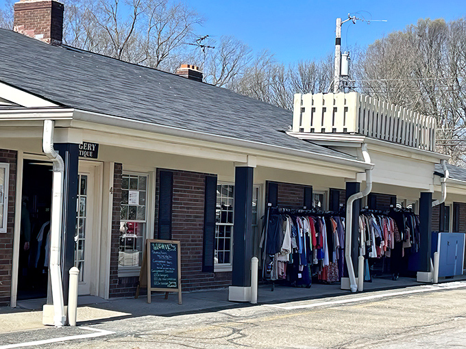 The charming brick exterior of The Toggery welcomes treasure hunters with its classic storefront design and sidewalk displays.
