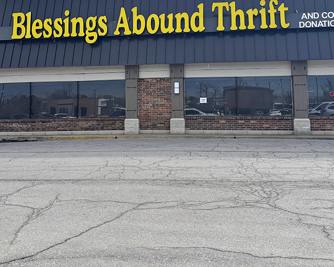 The bright yellow sign beckons like a treasure map X marking the spot. This unassuming storefront hides a wonderland of second-hand gems waiting to be discovered.