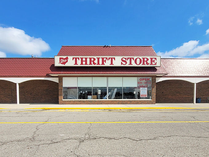 Under clear blue skies, the bold red signage beckons like a lighthouse for the budget-conscious shopper seeking hidden gems.