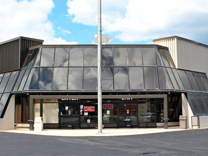 The distinctive angular entrance of Medina Antique Mall beckons treasure hunters with its retro architectural charm and promises of vintage wonders within.