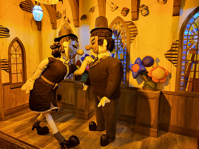 These peculiar puppet figures seem caught in mid-conversation, as if discussing which dimension they accidentally stumbled into today.