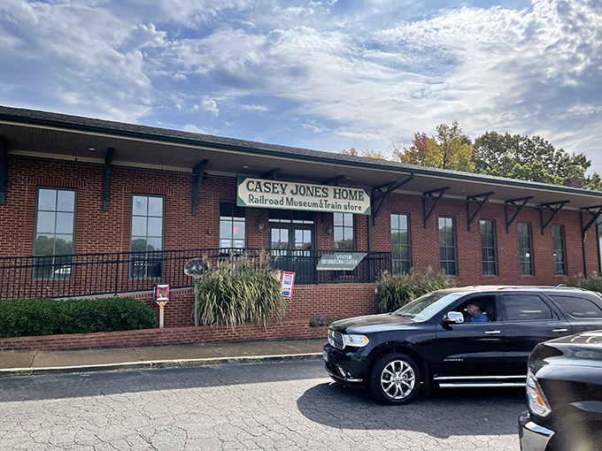 The brick facade of Casey Jones Home & Railroad Museum welcomes visitors with a promise of railroad history and Tennessee lore waiting inside.