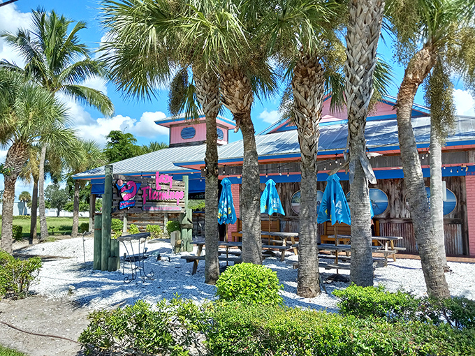 The Lazy Flamingo's cheerful exterior promises Florida fun with its bright blue trim and red railings&mdash;a casual seafood haven hiding in plain sight.