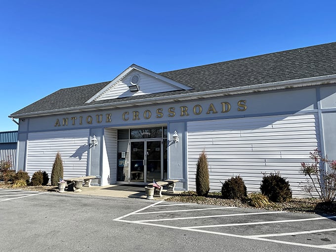The unassuming white exterior of Antique Crossroads belies the wonderland of treasures inside, like a poker player hiding a royal flush.