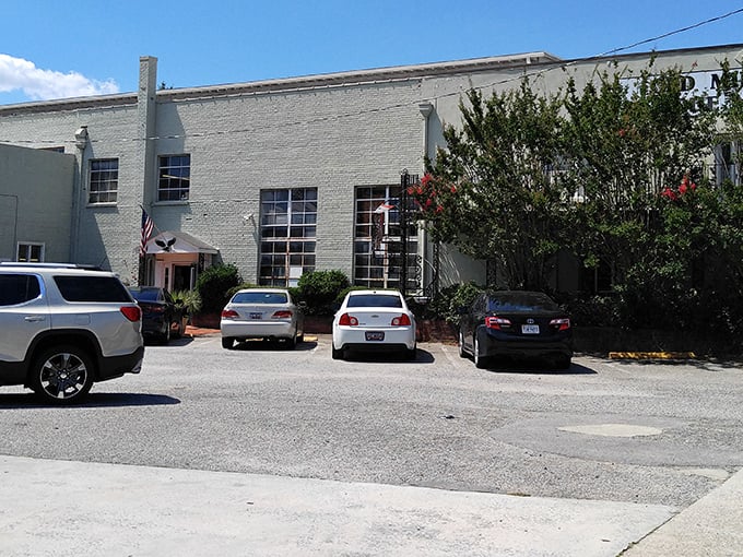 The unassuming exterior of Old Mill Antique Mall hides a universe of treasures within. Like a time-travel portal disguised as a brick building in West Columbia.