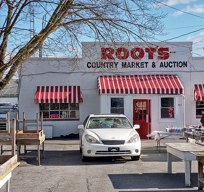 The iconic red and white awnings of Root's Country Market & Auction stand as a beacon for bargain seekers across Pennsylvania.