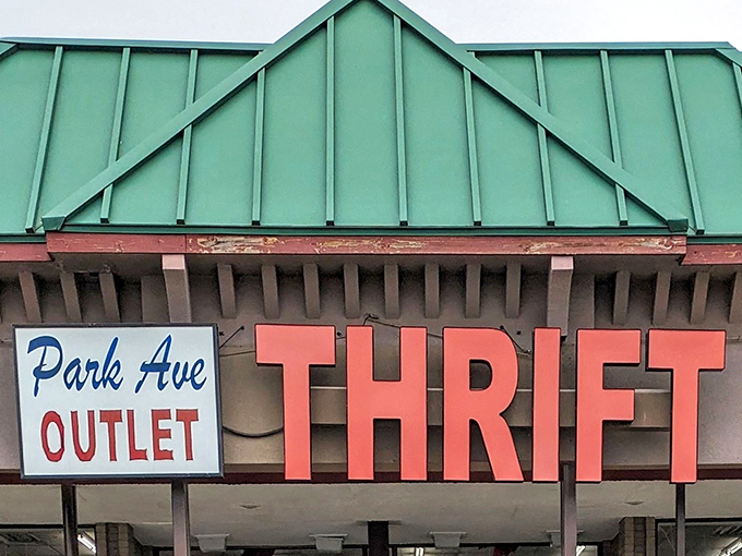 The unmistakable red and green facade of Park Avenue Thrift Outlet stands like a beacon for bargain hunters, promising treasures waiting to be discovered inside.