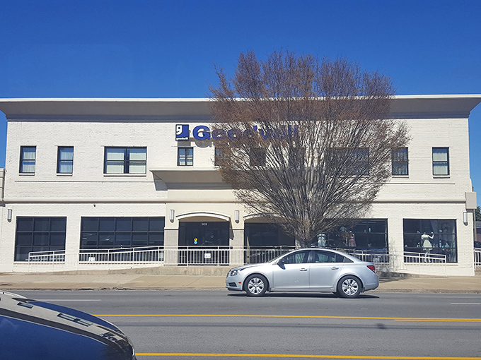The white brick facade of Goodwill Opportunity Center stands proudly against the blue Kentucky sky, like a department store from a more civilized age.