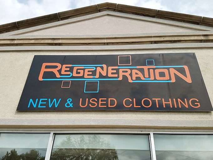 The retro-futuristic sign beckons like a portal to fashion's past and future, promising treasures within this Pleasant Ridge landmark.