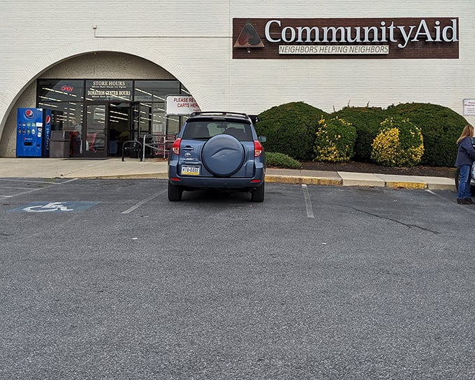 The entrance to CommunityAid beckons like a portal to bargain heaven, complete with that "I'm about to find something amazing" anticipation every thrifter knows.
