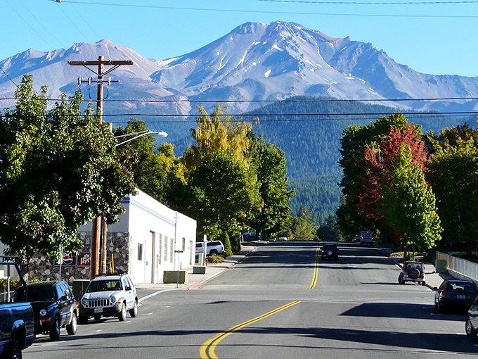 Mount Shasta dominates the skyline like a watchful guardian, turning an ordinary small-town street into a postcard-perfect scene that never gets old.