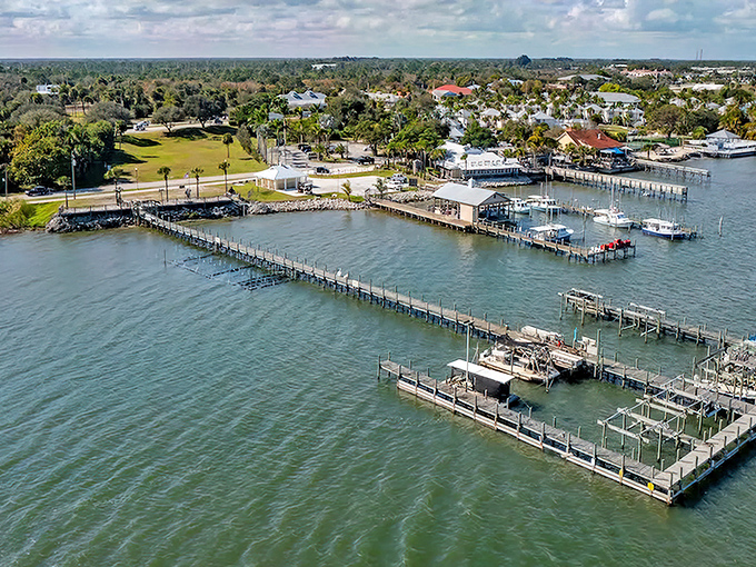 Sebastian's waterfront charm unfolds like a postcard come to life, where boats bob gently against wooden docks and palm trees sway in perfect Florida rhythm.