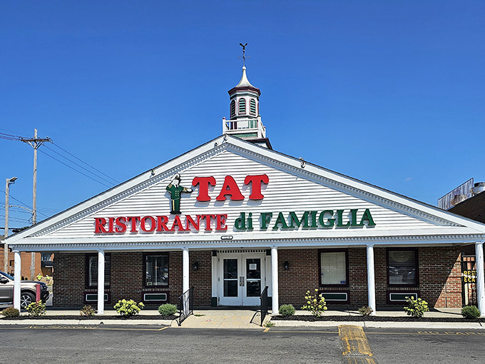 The iconic white facade of TAT Ristorante Di Famiglia stands proudly in Columbus, its red and green signage a beacon for Italian food lovers since 1929.