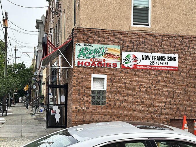 That iconic red and green signage announces to hungry Philadelphians that sandwich salvation awaits inside this unassuming brick corner.