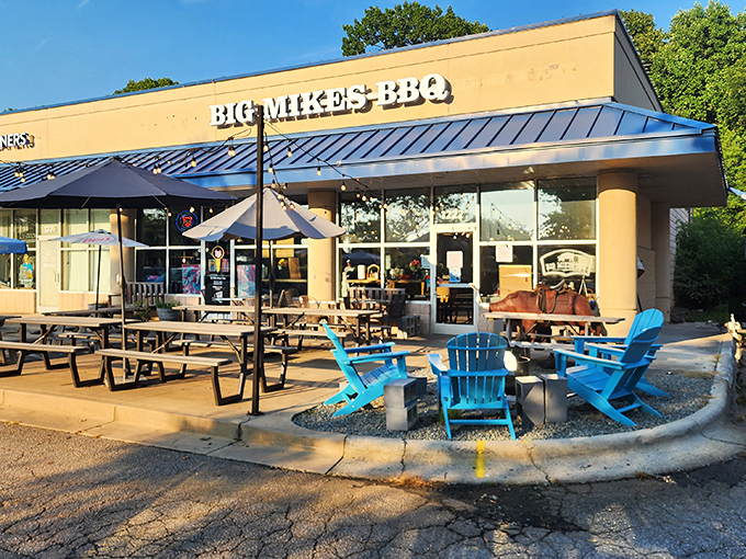 The unassuming storefront with its bright blue awning and inviting Adirondack chairs promises what every great BBQ joint should: substance over style and meat over everything else.