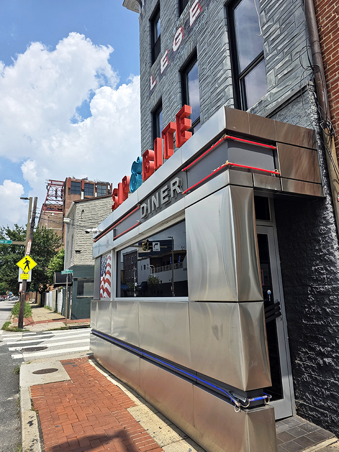 The classic stainless steel exterior of Sip & Bite stands as a shining beacon of comfort food in Baltimore's Canton neighborhood.