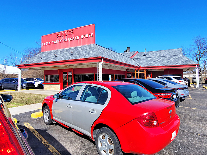 The bright red roof of Bunny's Hasty Tasty stands out like a breakfast lighthouse guiding hungry souls to pancake paradise.