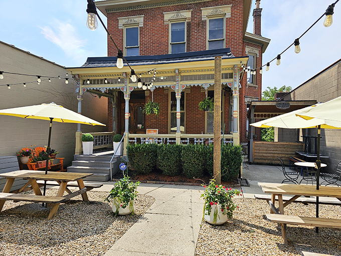 This charming brick building isn't just another pretty facade&mdash;it's a temple of smoke where BBQ dreams come true. String lights add a touch of magic to the outdoor seating area. 
