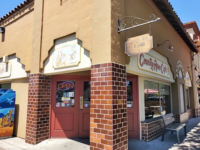 The corner spot that launched a thousand breakfast pilgrimages. Country Rose Caf&eacute;'s Spanish-style exterior promises culinary treasures within.