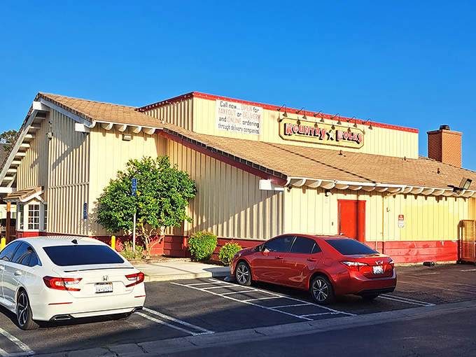 A butter-yellow building with rustic charm that promises comfort food salvation, not architectural pretension. The calories start counting the moment you park.