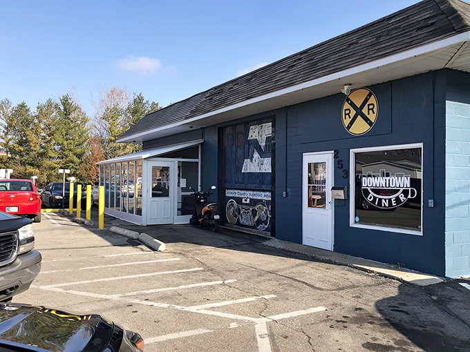 The blue exterior of Downtown Diner stands like a beacon of breakfast hope in Frankfort, complete with railroad crossing sign that promises your taste buds are about to be on the right track.