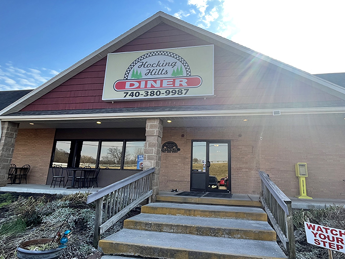 The burgundy exterior of Hocking Hills Diner stands like a beacon of breakfast hope in Logan, Ohio. Watch your step—great food awaits!