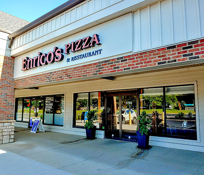 The unassuming storefront of Enrico's Pizza & Restaurant proves once again that culinary treasures often hide in plain sight, nestled between ordinary strip mall neighbors.