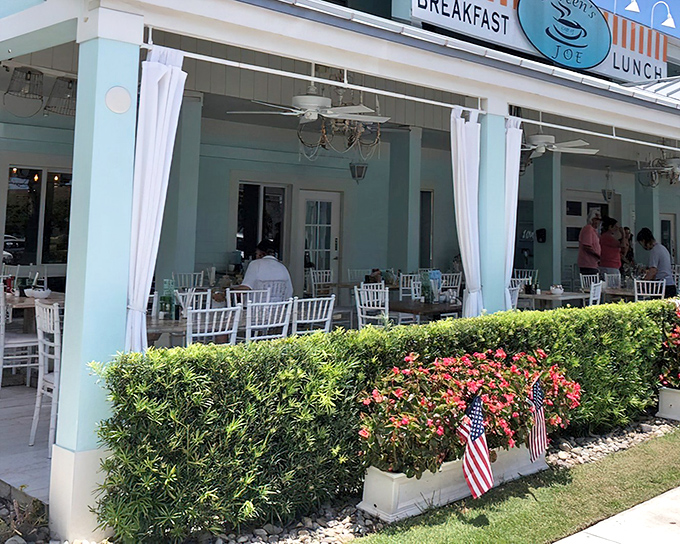 White curtains dance in the Gulf breeze as diners enjoy al fresco breakfast beneath a canopy of Florida sunshine.