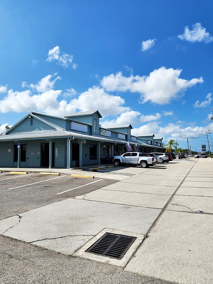 The unassuming blue exterior of Peter's Restaurant stands like a culinary lighthouse amid Port Charlotte's Tamiami Trail, promising comfort food treasures within.
