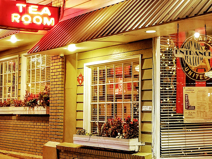 The neon "TEA ROOM" sign glows like a beacon of Southern comfort, promising culinary salvation to hungry Atlanta souls wandering Ponce de Leon Avenue.
