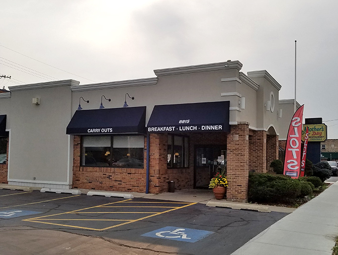 The unassuming exterior of Mother's Day Restaurant hides a breakfast paradise within. Navy awnings and brick fa&ccedil;ade set the stage for comfort food magic.