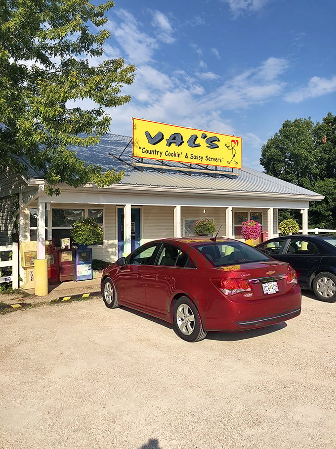 The bright yellow sign promises "Country Cookin' & Sassy Servers" &ndash; a combination that's as irresistible as it is honest.