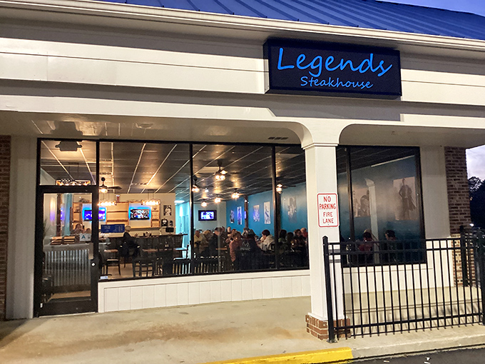 The blue neon sign of Legends Steakhouse glows like a carnivorous lighthouse, beckoning hungry travelers to this unassuming strip mall treasure in Newberry.