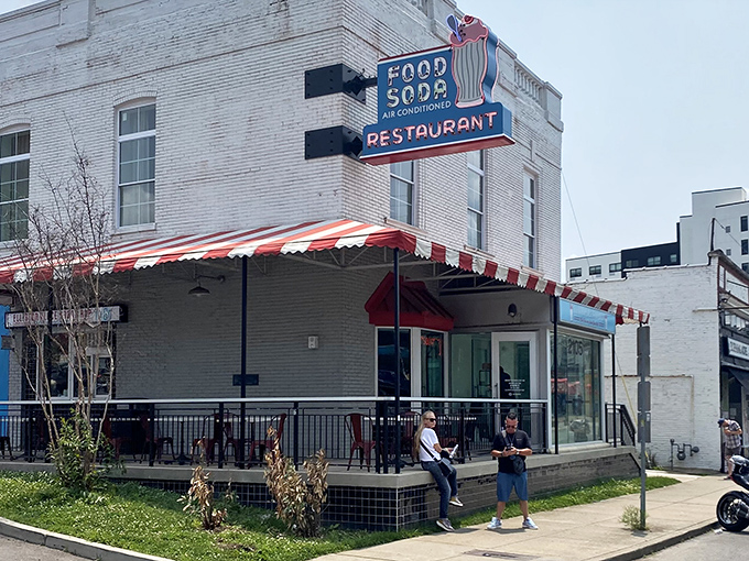 That classic red and white striped awning isn't just decoration&mdash;it's a beacon calling to anyone with a hankering for authentic diner magic.