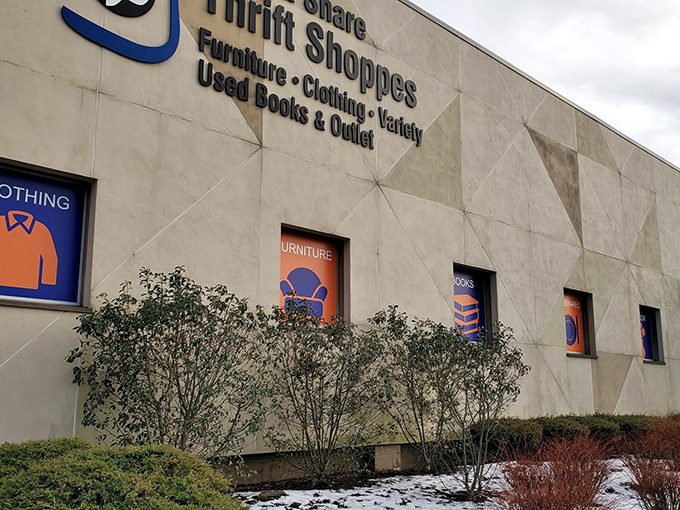 The exterior facade of Care & Share Thrift Shoppes stands like a department store of possibilities, with clear signage guiding treasure hunters to their quarry.