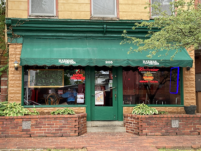 The green awning beckons like an old friend on Marietta's brick-lined streets. This isn't just a tavern&mdash;it's a time machine with cold beer.