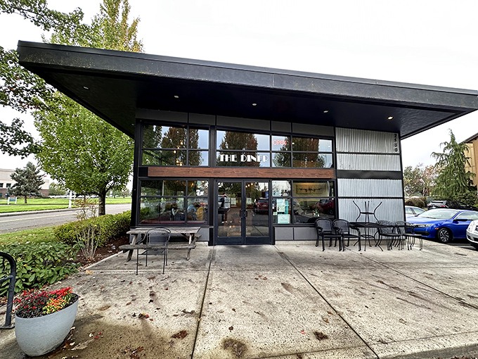 The modern exterior of The Diner defies nostalgic expectations, offering a sleek architectural welcome that says, "This isn't your grandpa's greasy spoon."
