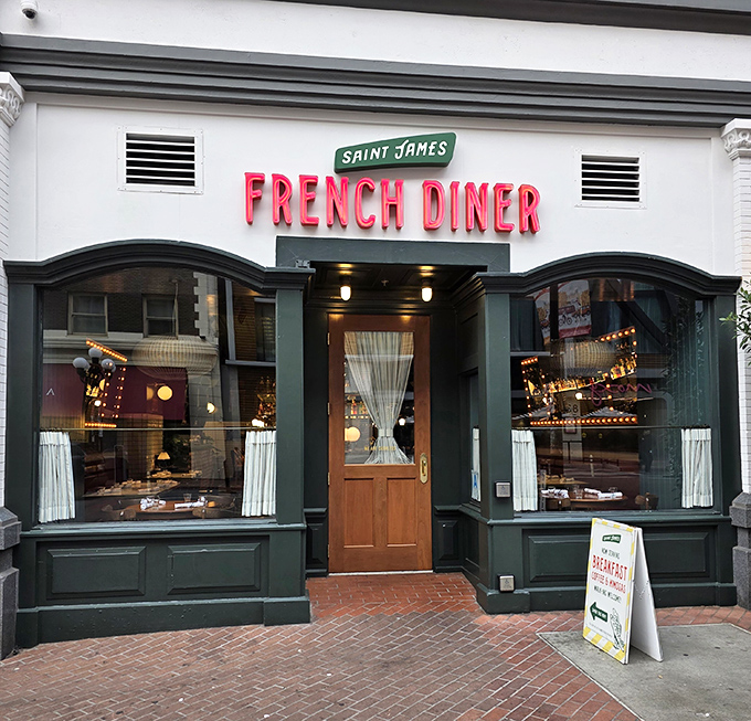 The wooden door and green trim whisper "Parisian side street," while the neon screams "Get in here and eat something magnificent already!"