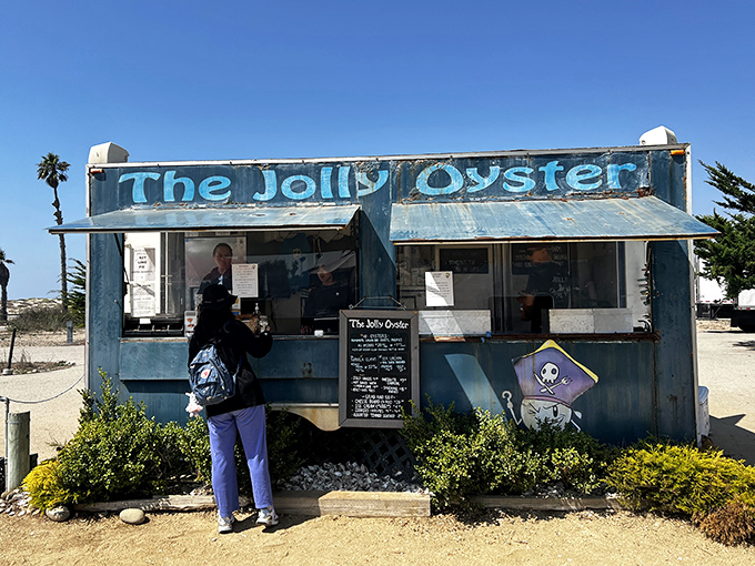 The weathered blue shack with "The Jolly Oyster" painted across the top isn't trying to impress anyone&mdash;until you taste what's inside. California coastal dining at its most honest.