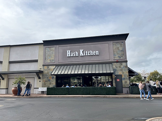 The modern exterior might seem unassuming, but inside awaits a breakfast revolution that's drawn crowds since day one.